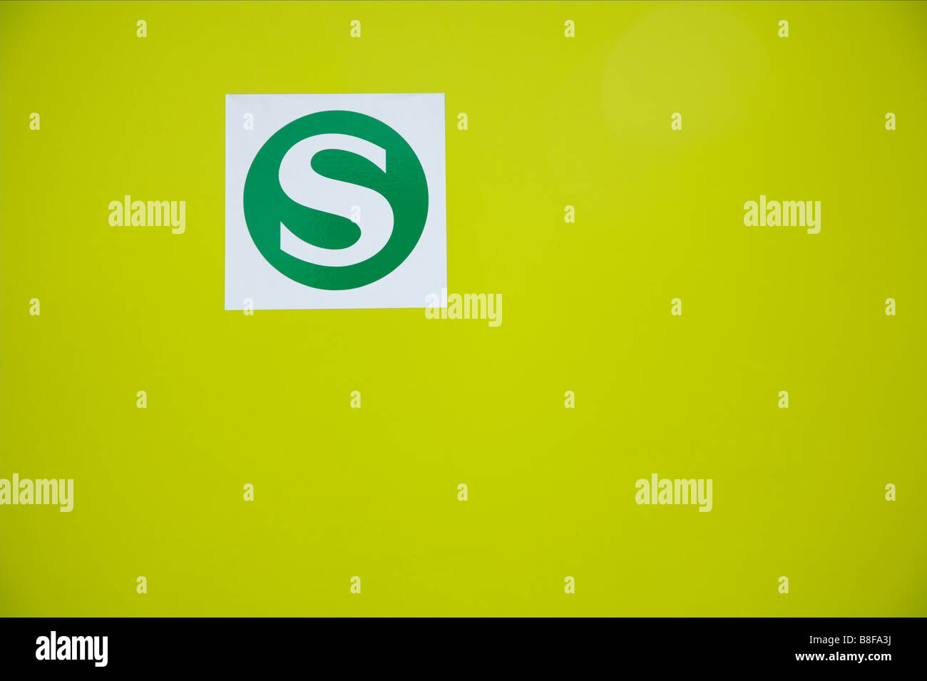 Subway sign at yellow wall Stock Photo - Alamy