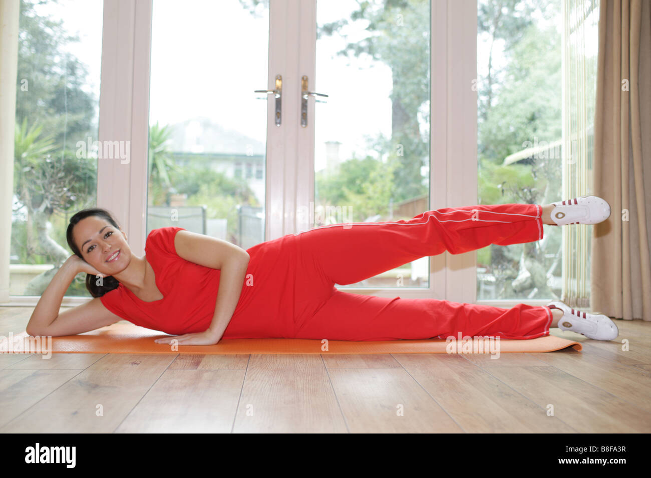 Woman side leg raise hi-res stock photography and images - Alamy