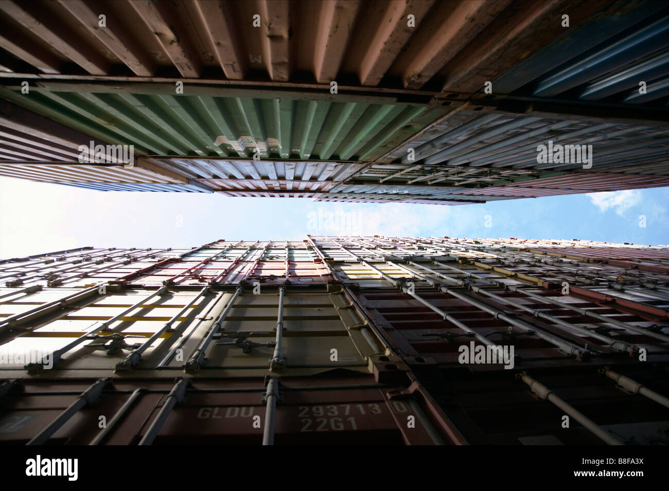Between stacks of shipping containers Stock Photo - Alamy