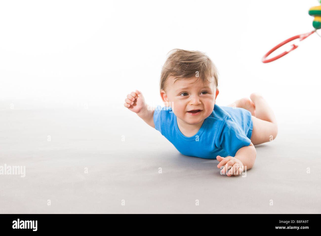 baby boy crawling on the floor Stock Photo - Alamy
