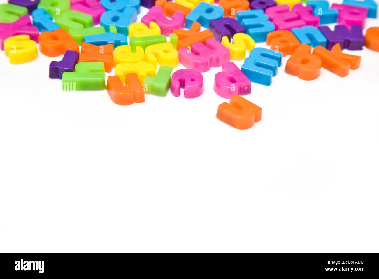 Magnetic letters isolated on a white studio background Stock Photo - Alamy