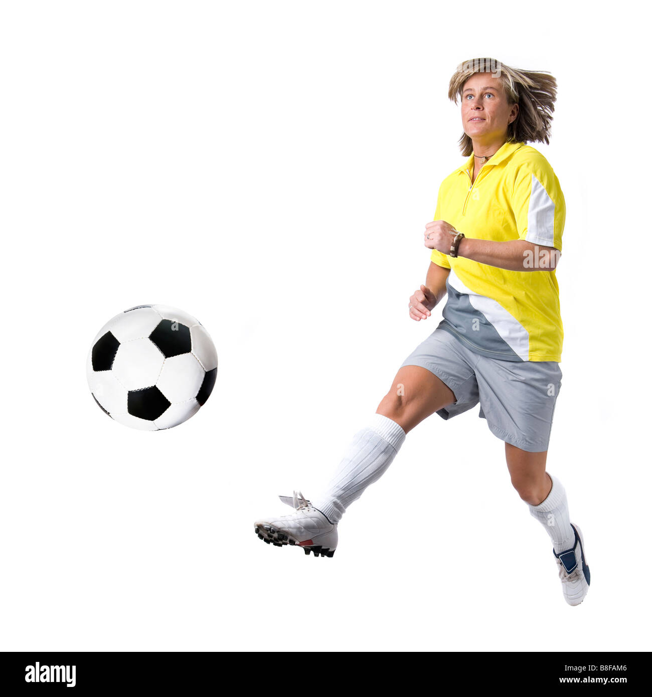 Full isolated picture of a caucasian woman playing soccer Stock Photo ...
