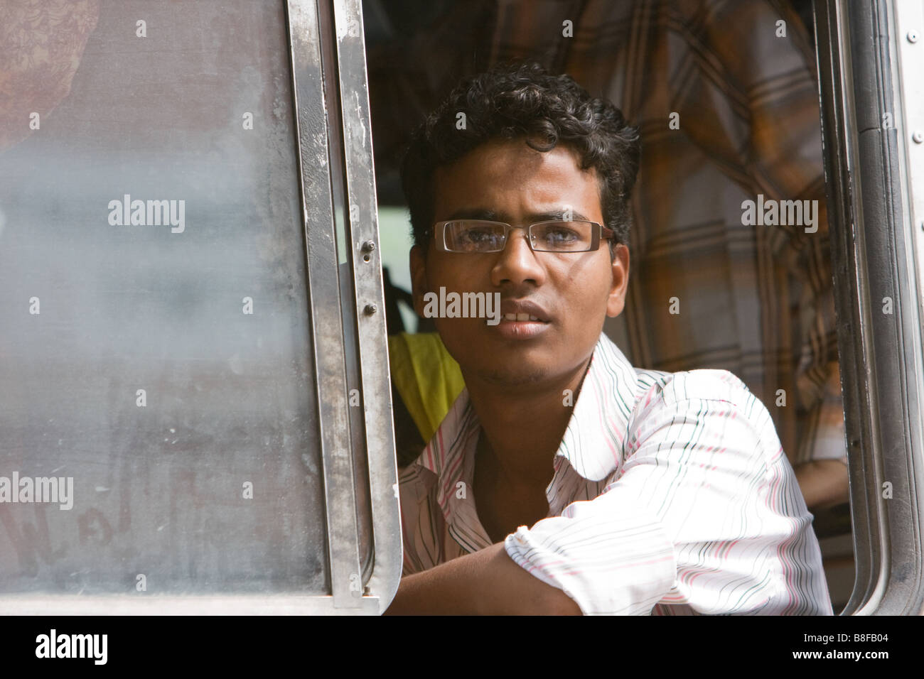 Indian male passenger looking through bus window, Jaipur, India Stock ...