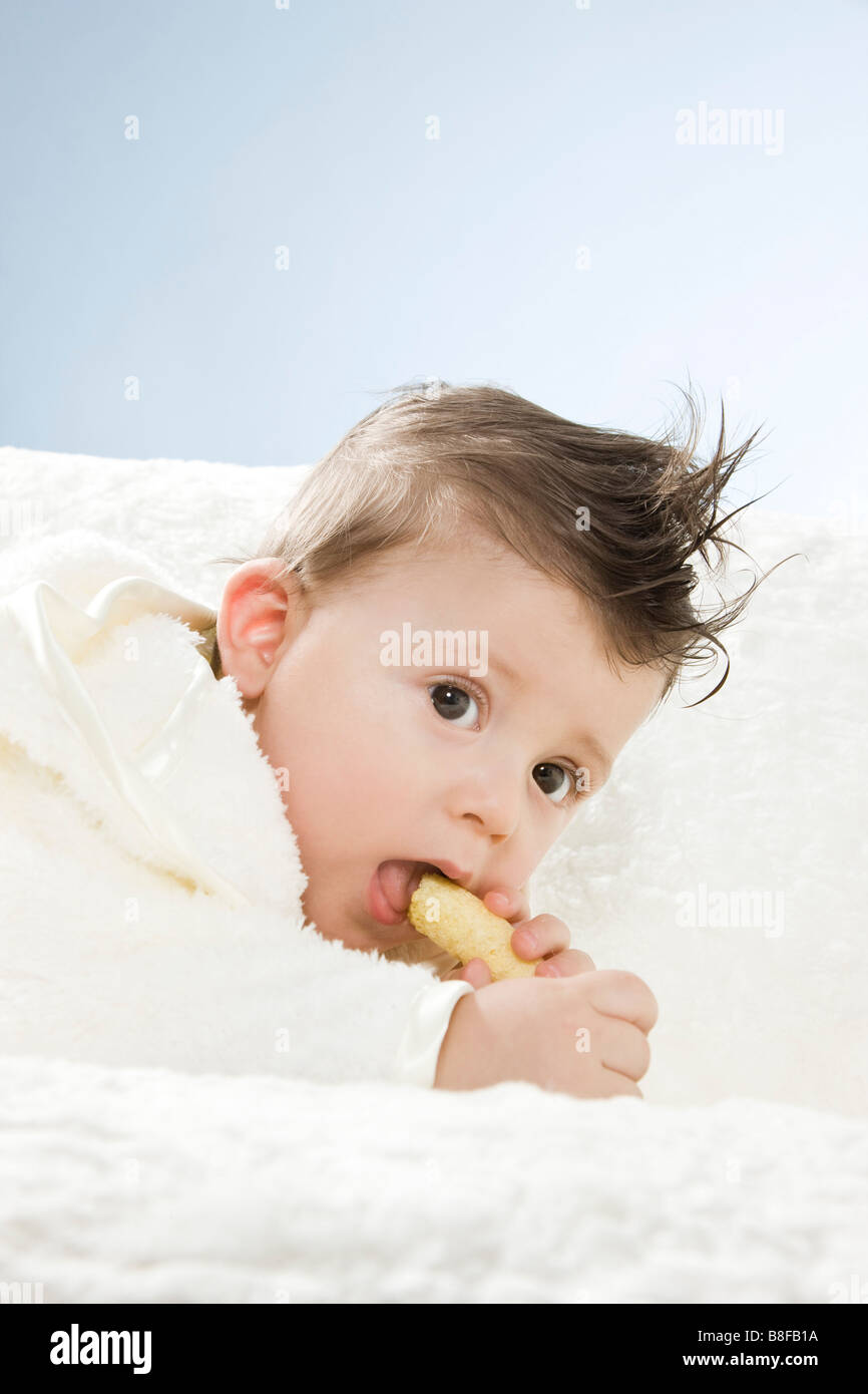 baby eating cookie Stock Photo - Alamy
