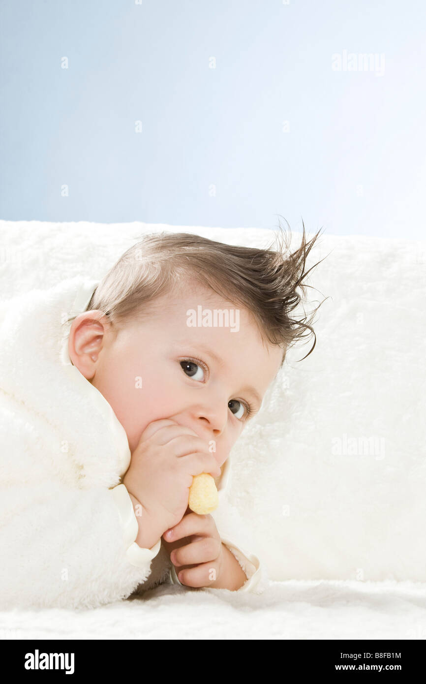 baby eating cookie Stock Photo - Alamy
