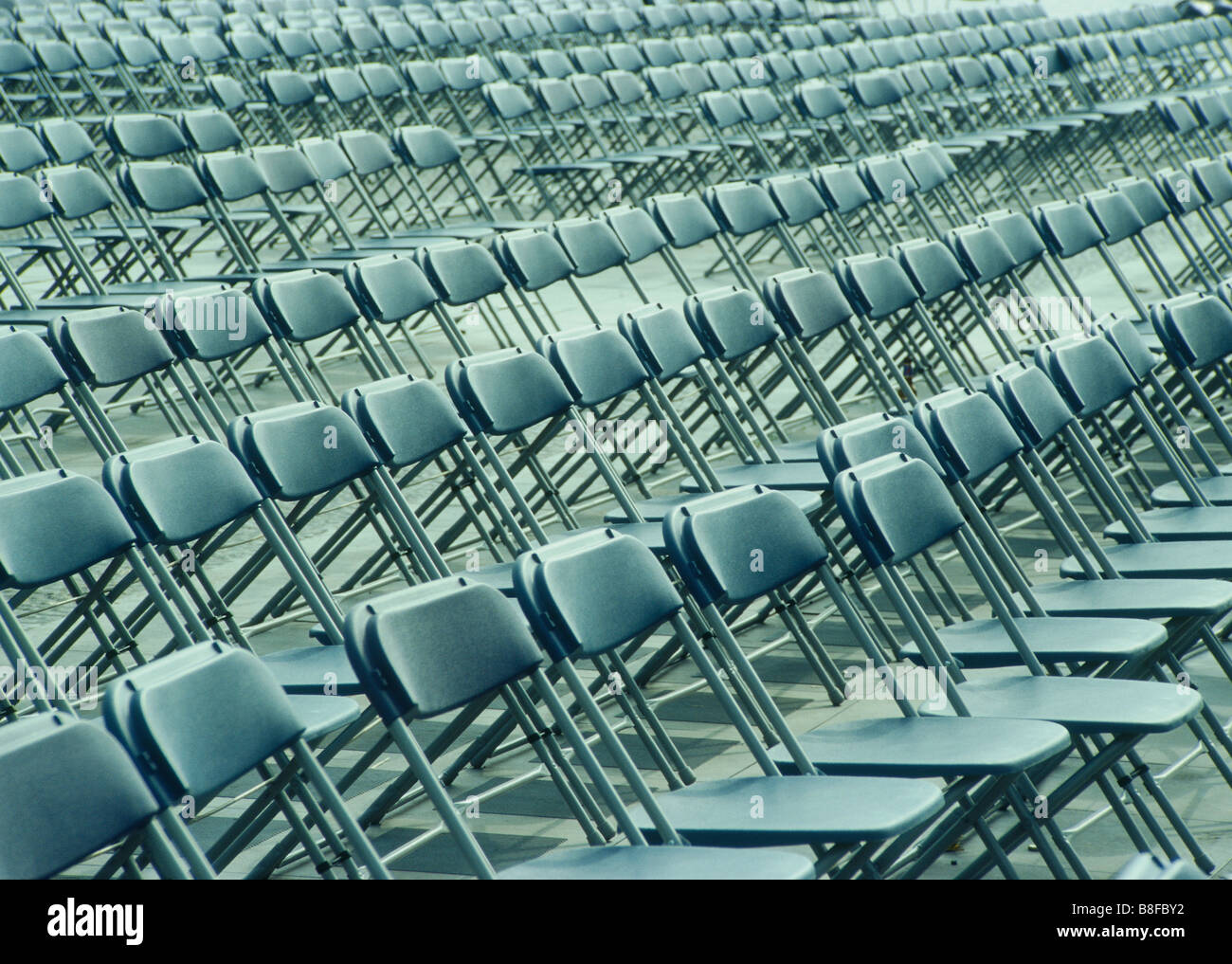 Rows of folding chairs Stock Photo - Alamy
