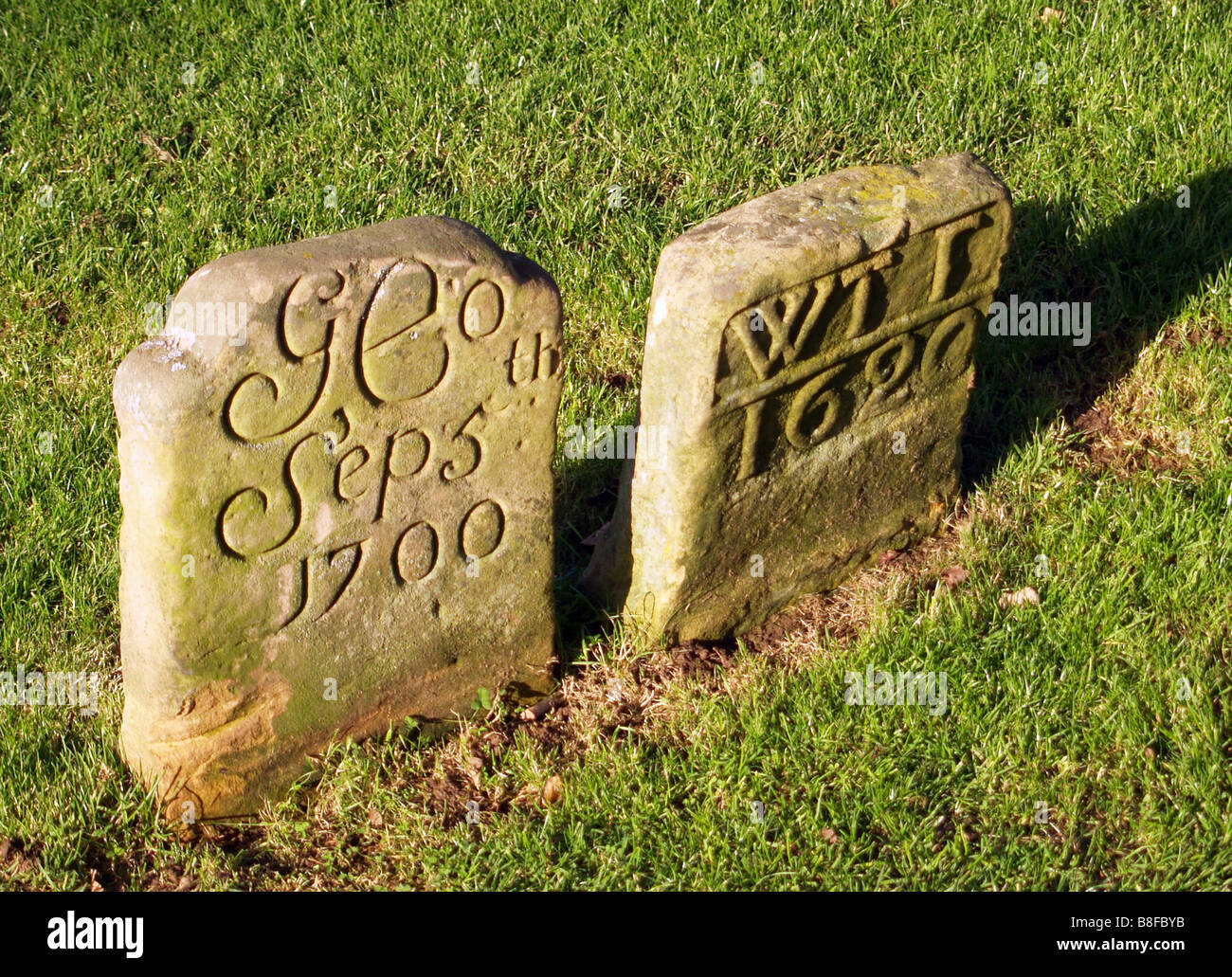Close up of stone headstones, in a church graveyard Stock Photo - Alamy