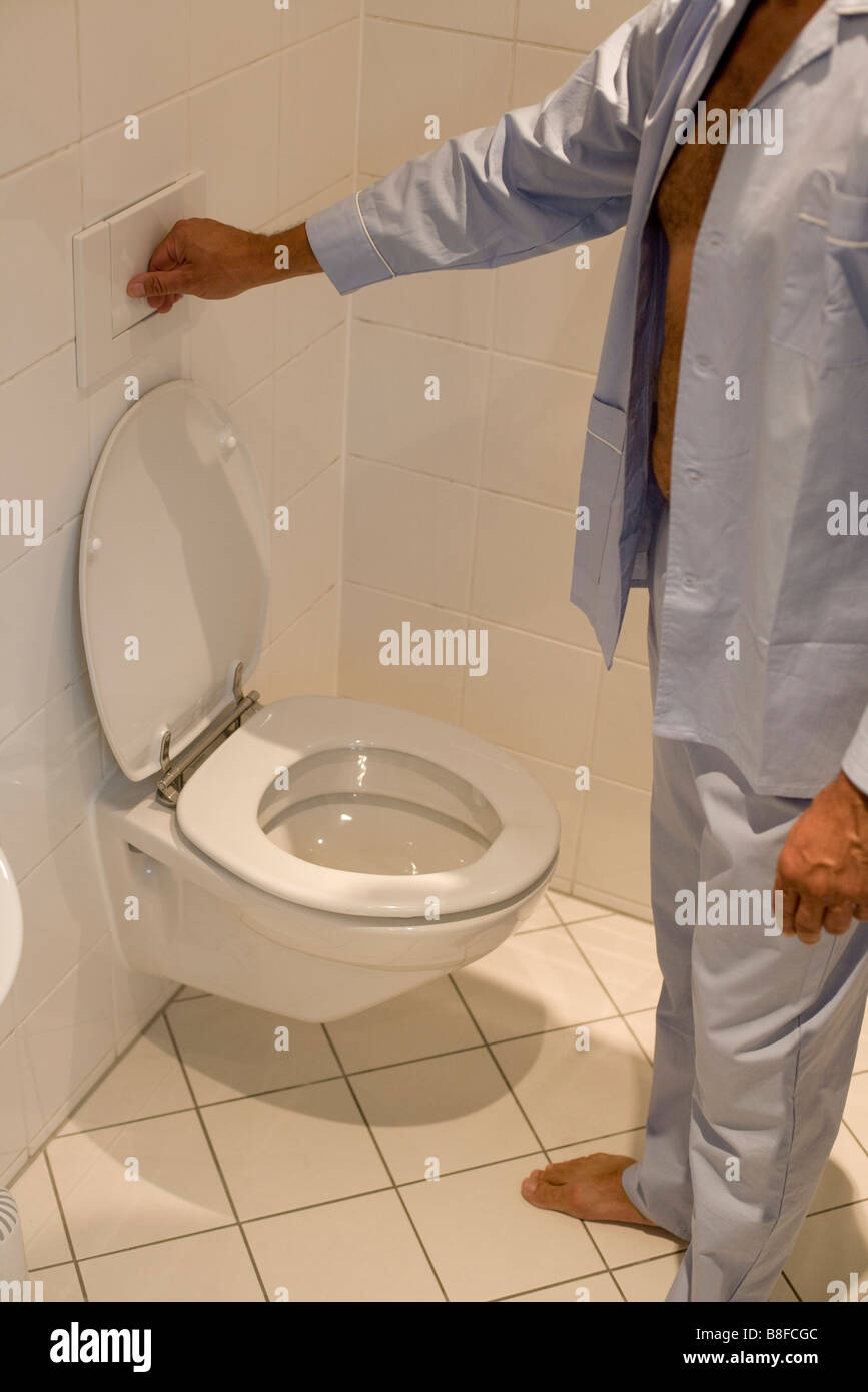 Man flushing toilet, Munich, Bavaria, Germany Stock Photo - Alamy