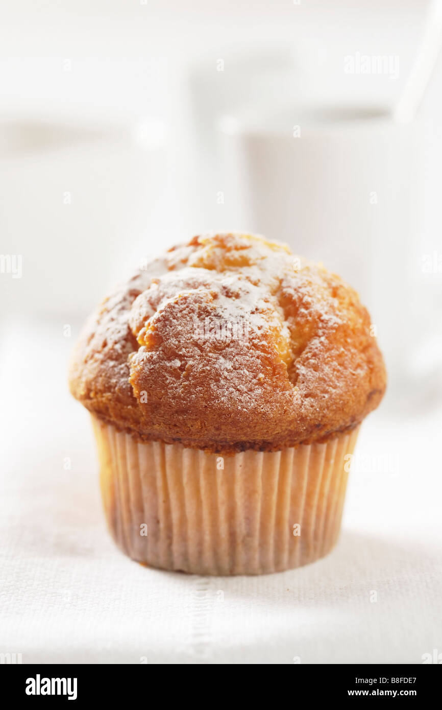 Muffin covered with powdered sugar Stock Photo - Alamy