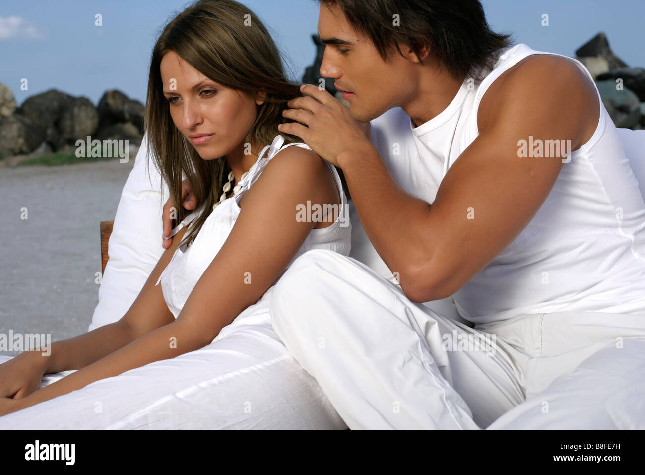 Man fondling woman's hair Stock Photo - Alamy