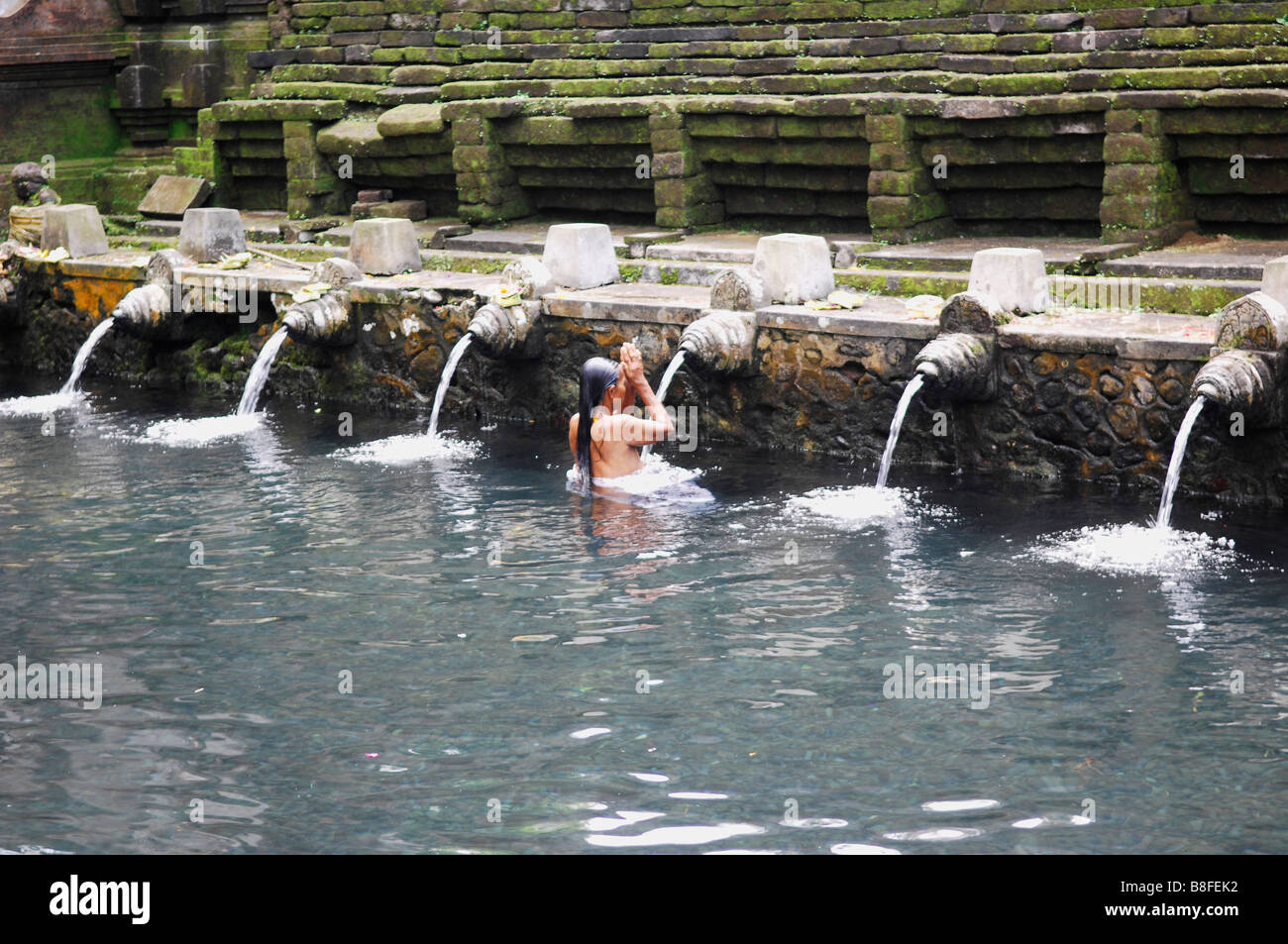 Balinese woman is praying at holy water,Bali.Indonesia Stock Photo - Alamy