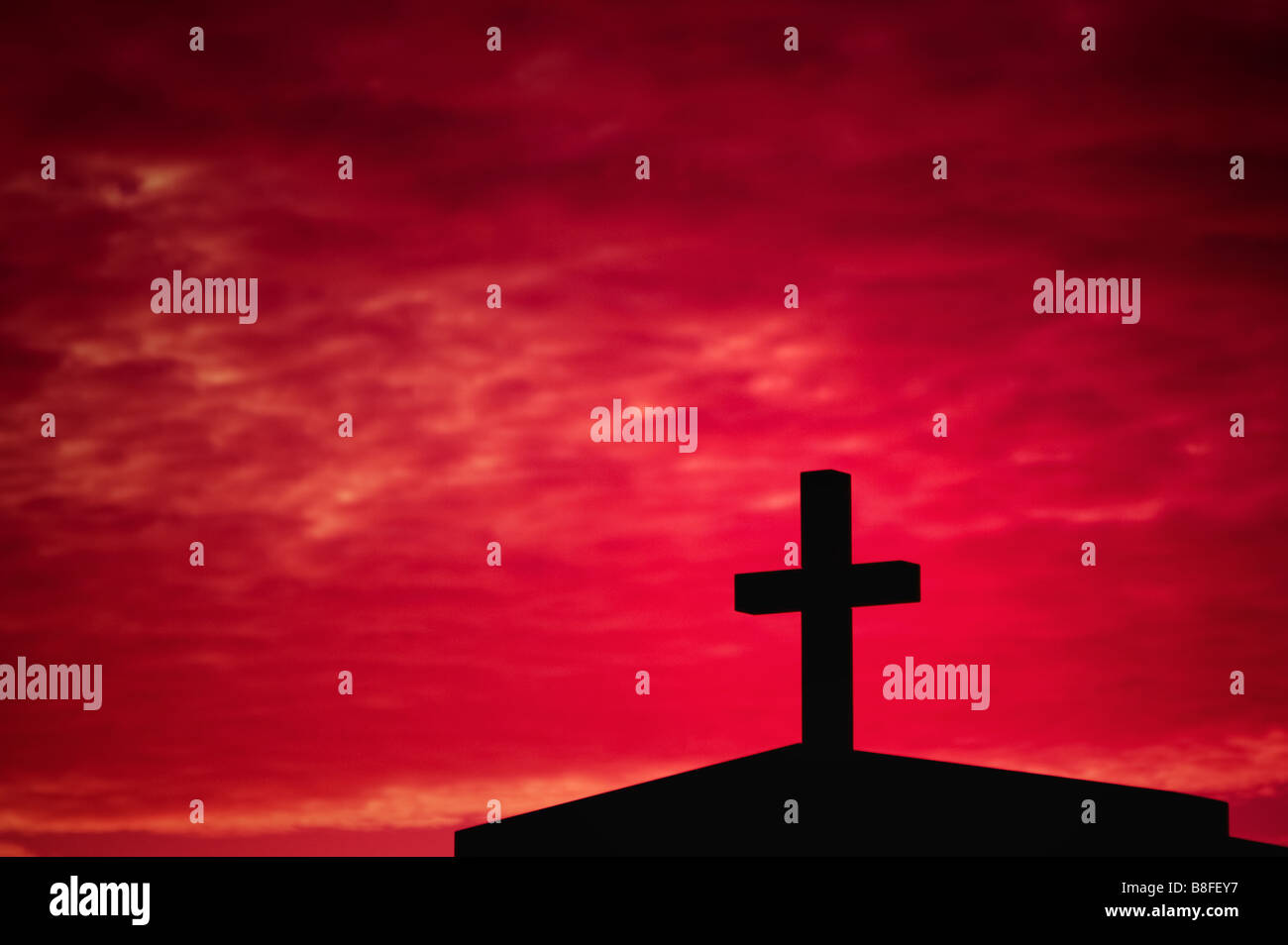 Cross on the top of a Catholic church at sunset time Stock Photo - Alamy