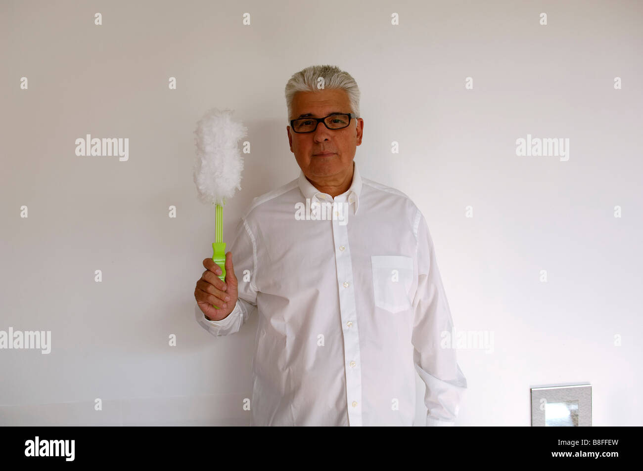 Man with feather duster hi-res stock photography and images - Alamy