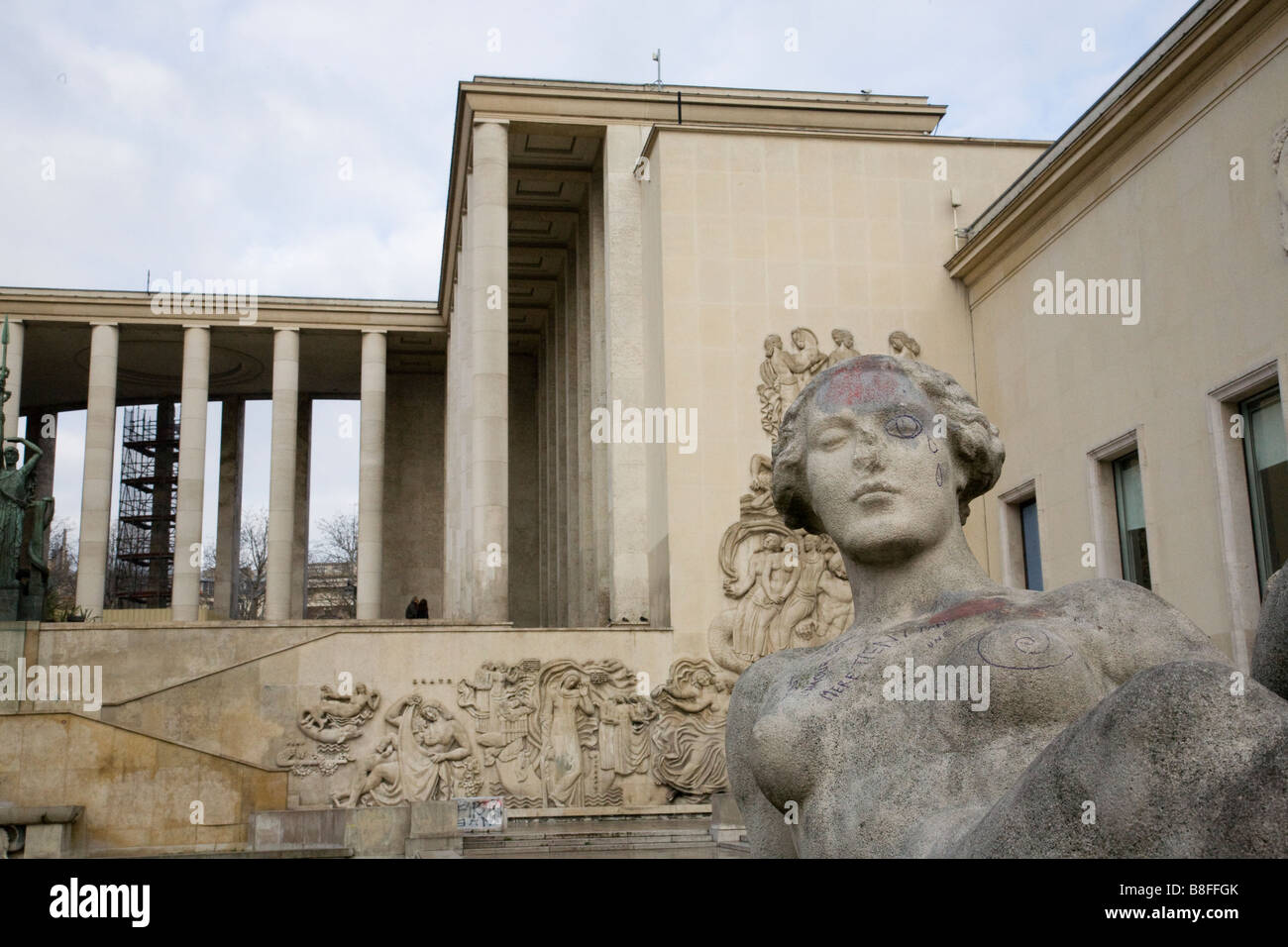 A statue sitting outside the museum of modern art has graffiti all over ...