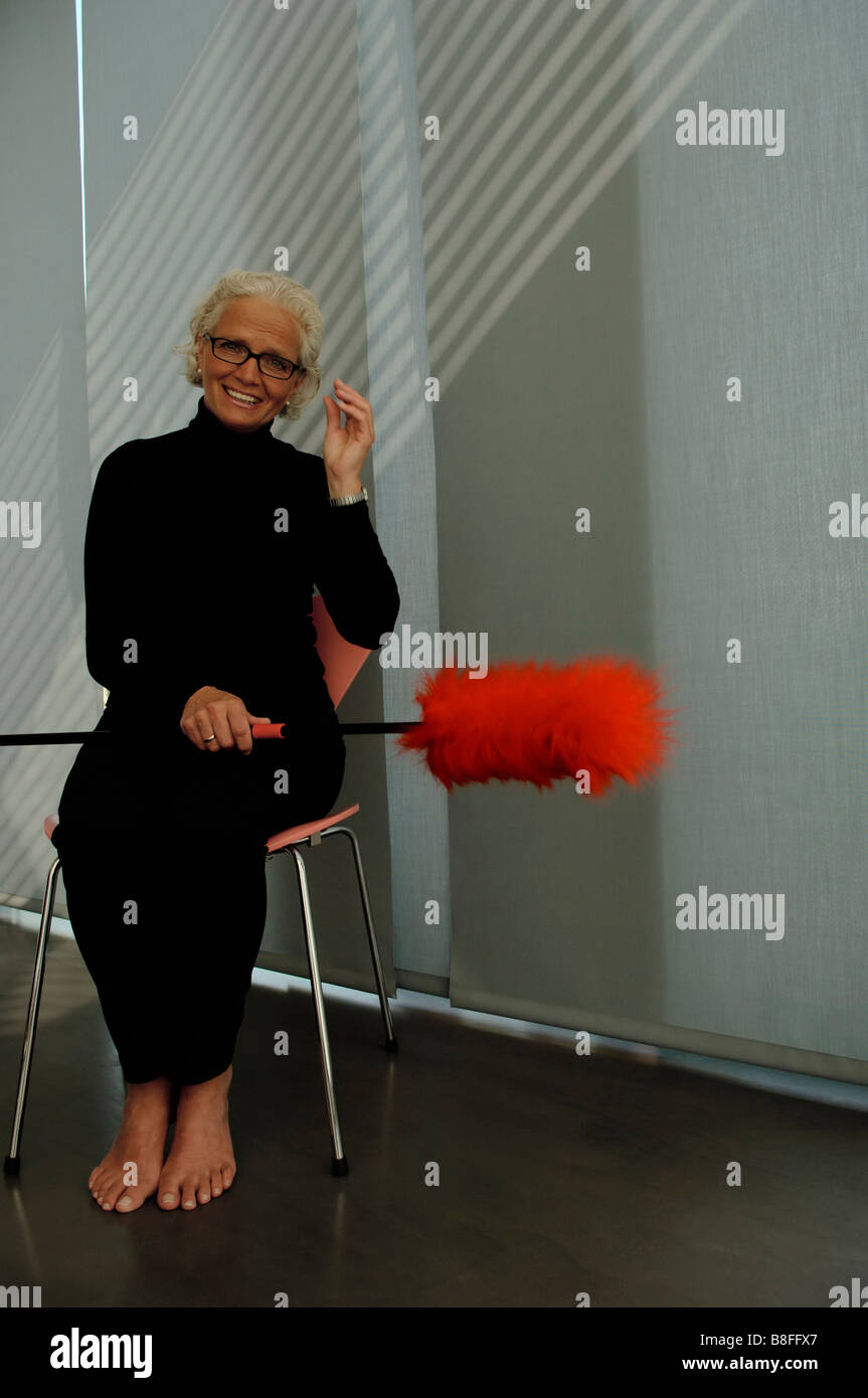 Senior woman duster hi-res stock photography and images - Alamy