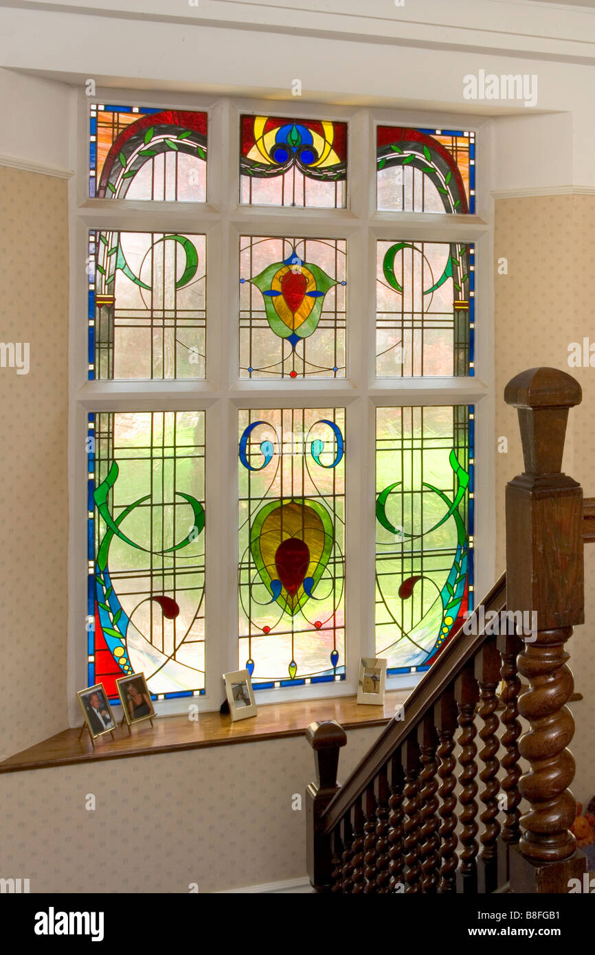 UK. A house interior, colourful stained galass window feature Stock ...