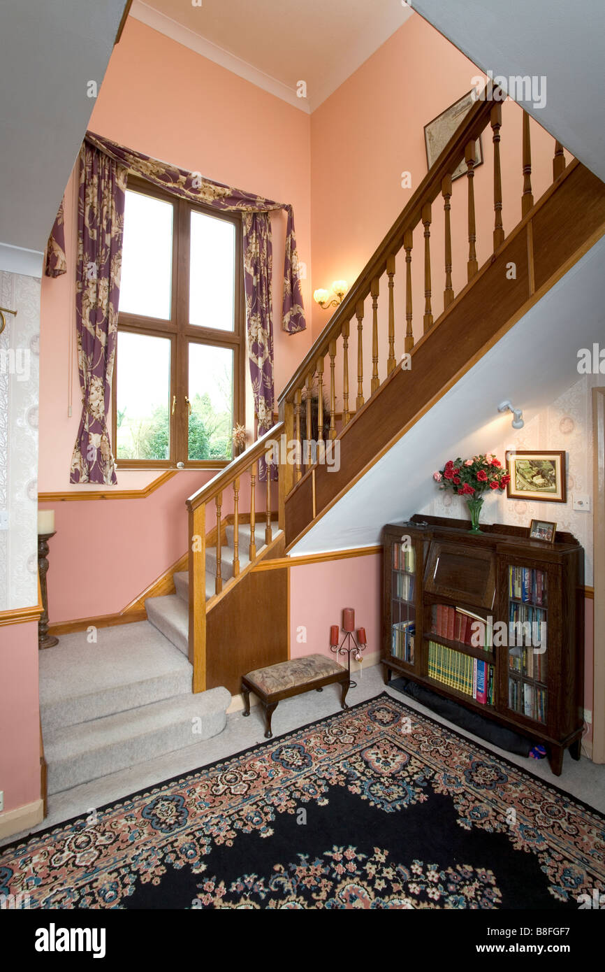 UK. A house interior, traditional entrance hall and staircase Stock ...