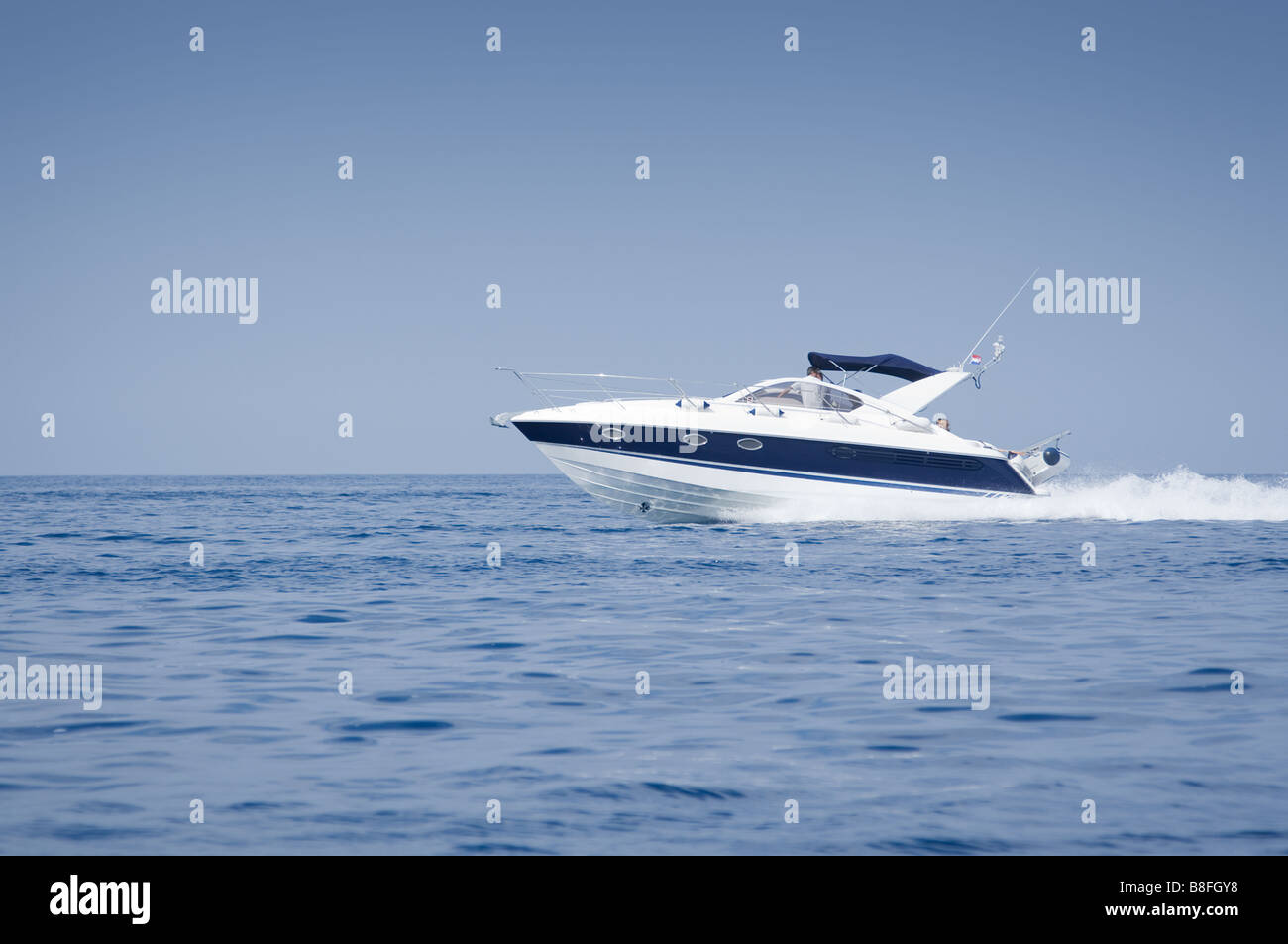 Motorboat speeding on the sea Stock Photo - Alamy