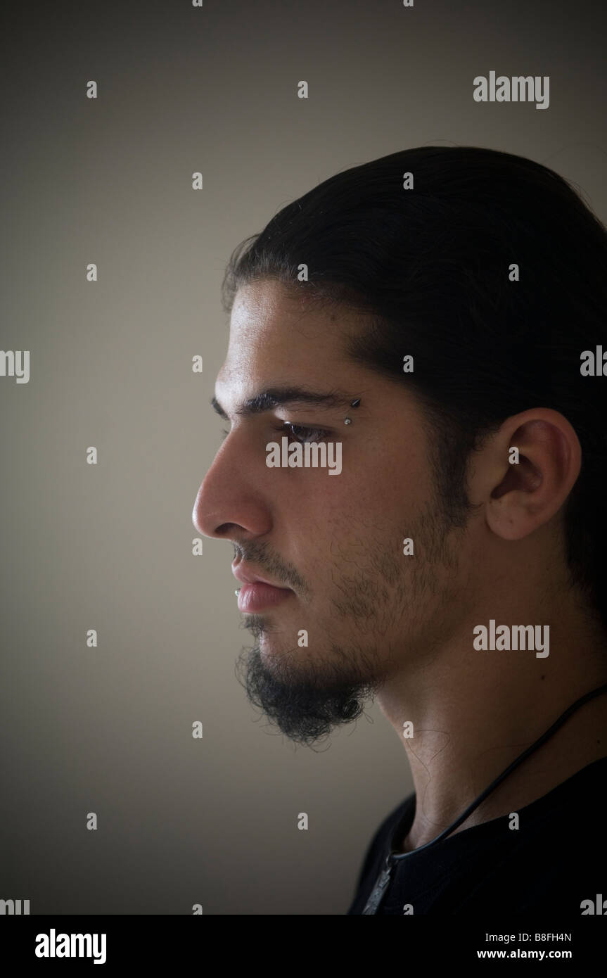 Profile of a young man with a goatee in deep thoughts Stock Photo - Alamy
