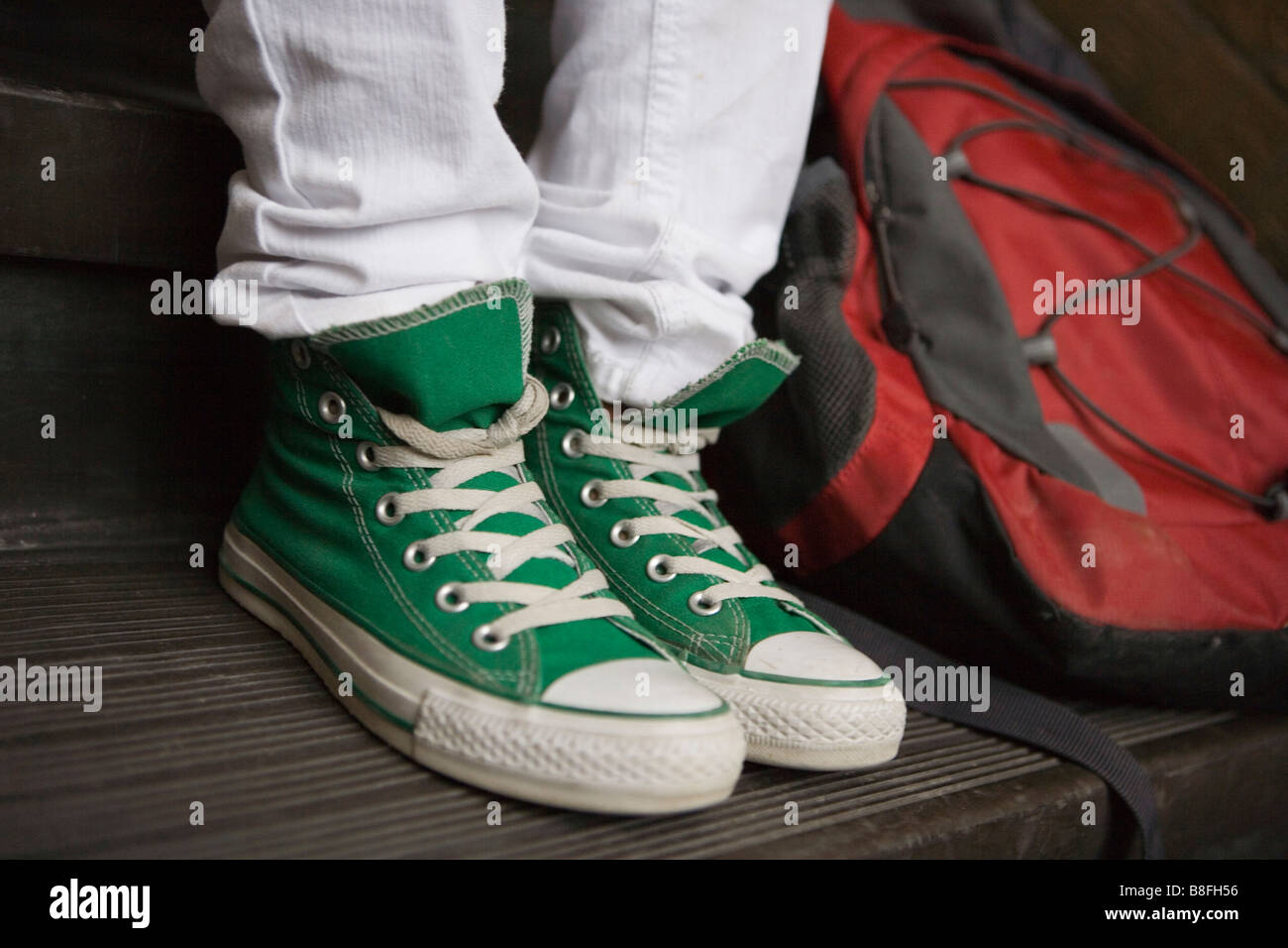 close up of green high top sneakers worn by teenager Stock Photo - Alamy