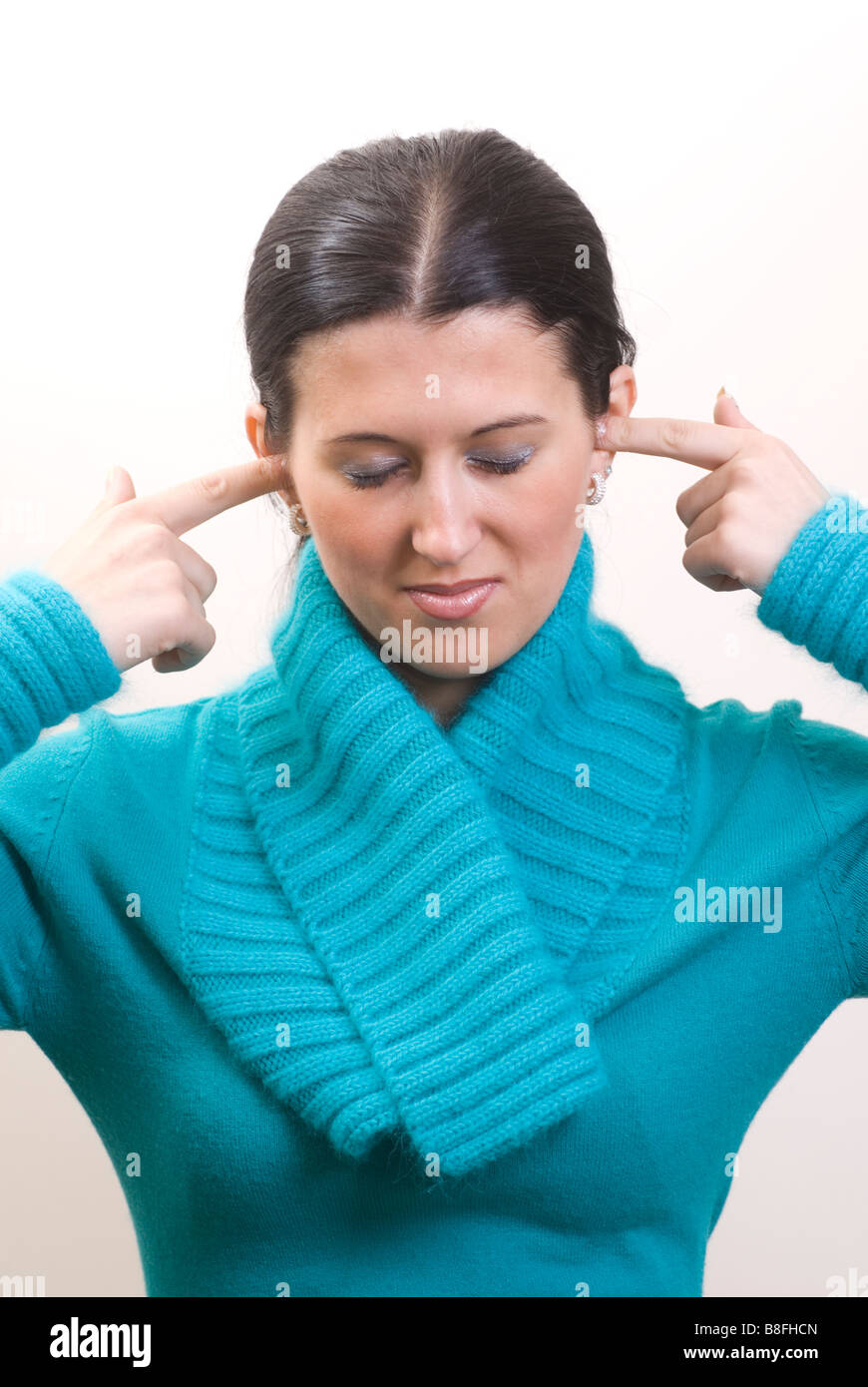 Young woman fingers in ears Stock Photo - Alamy