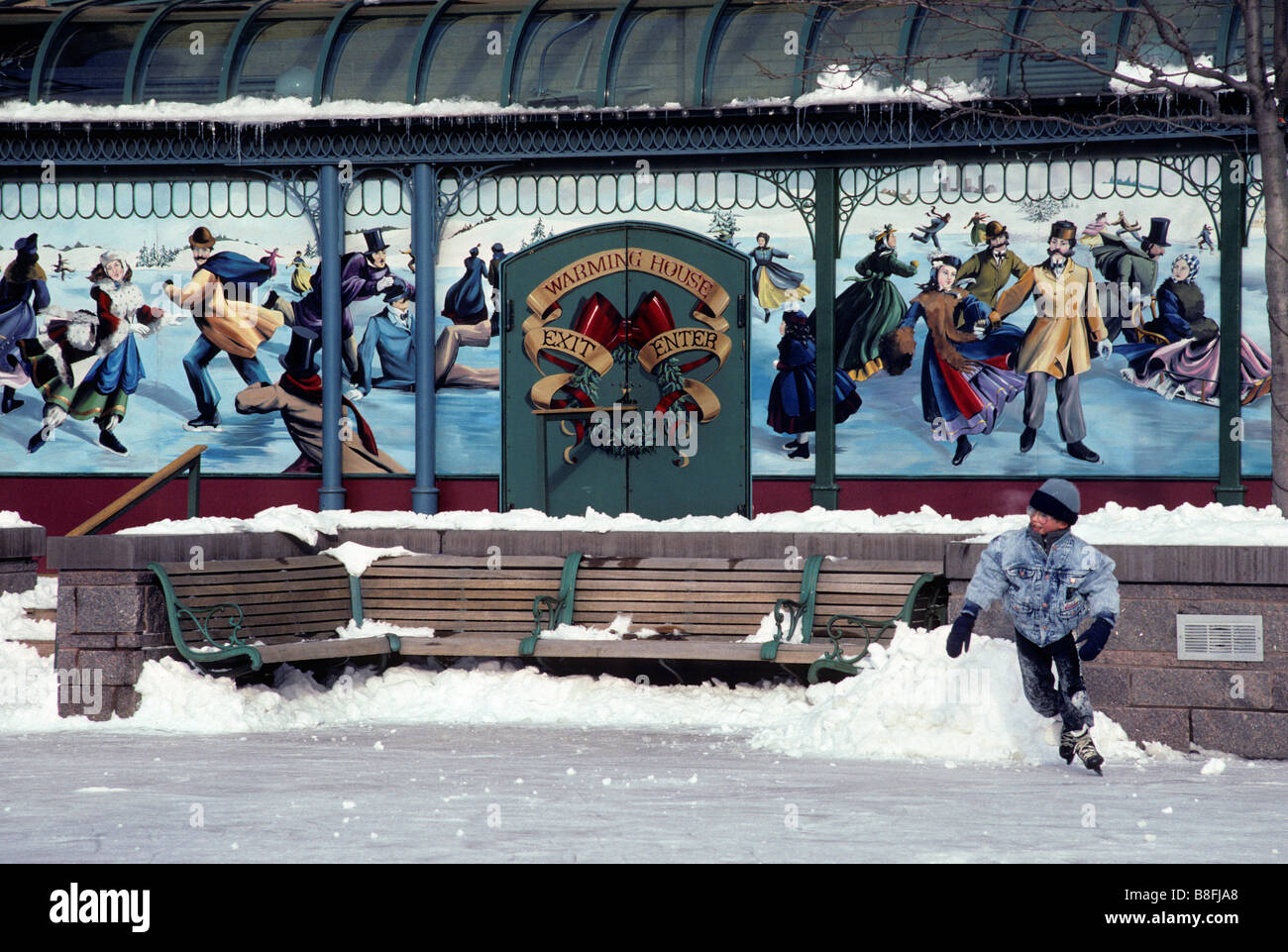 YOUNG BOY ICE SKATING AT RIVERPLACE, A COMPLEX OF SHOPS AND RESTAURANTS ...