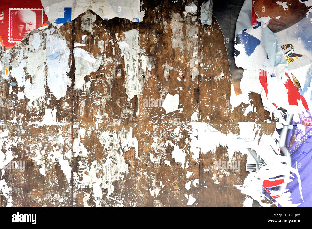 ripped bilboard posters remanant Stock Photo - Alamy
