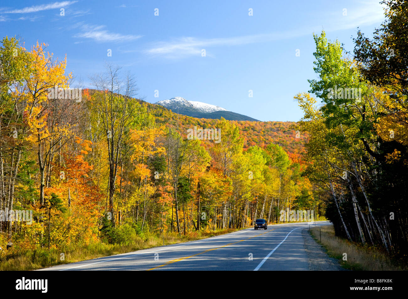 Fall foliage color with snow on Mount Lafayette and the roadways ...