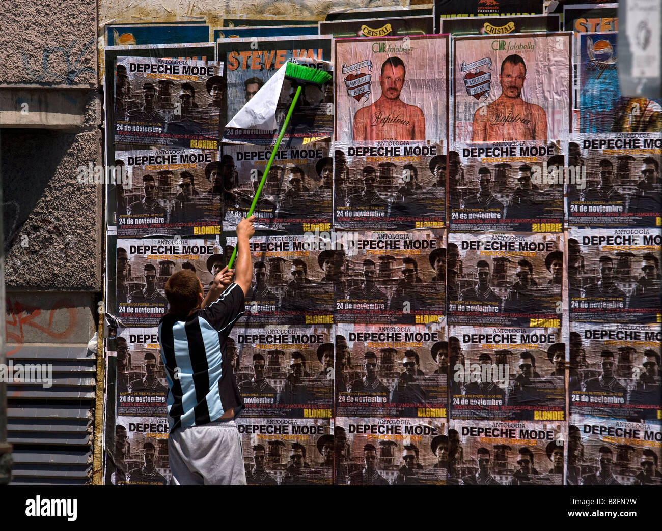 Man putting up posters hi-res stock photography and images - Alamy