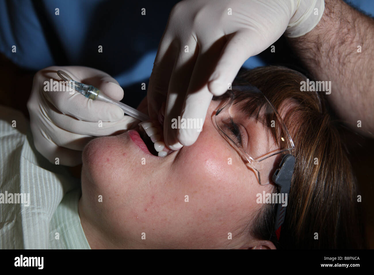 Dentist repairing teeth patient hi-res stock photography and images - Alamy