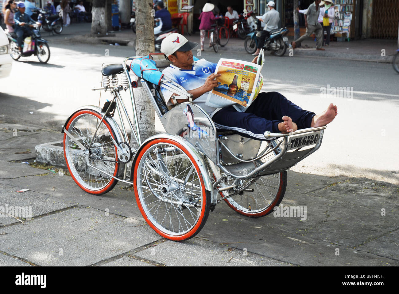 Cyclo driver in Vietnam Stock Photo - Alamy