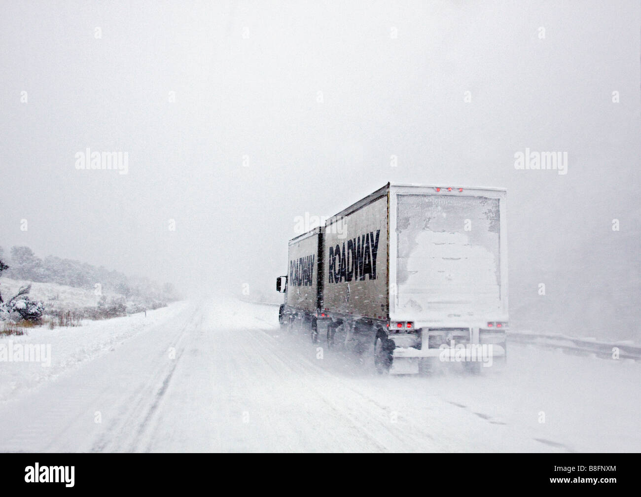 RoadWay truck on Interstate 70 in Colorado during a snow storm Stock ...