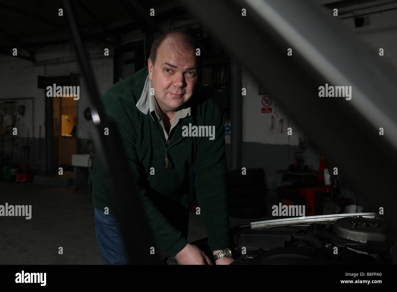 Mechanic Working Hard On Car High Resolution Stock Photography and ...