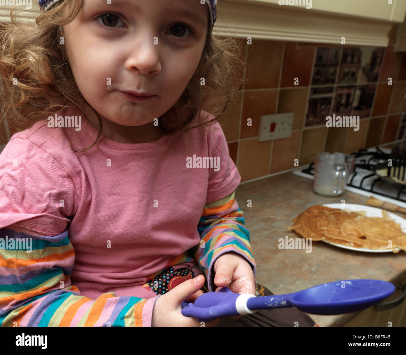 Making Pancakes on Shrove Tuesday Child with Mixing Spoon Stock Photo ...