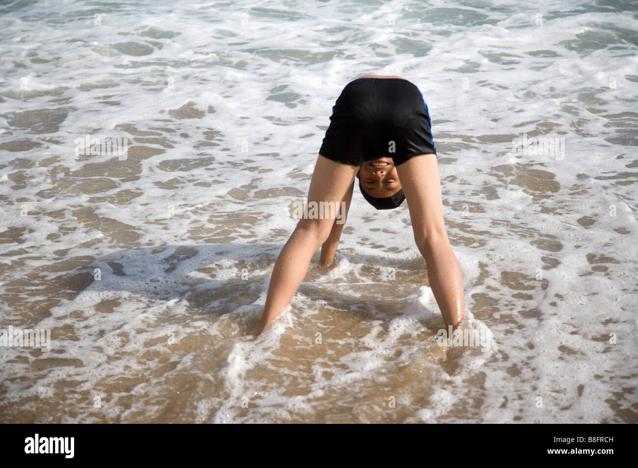 Boy headstand beach hi-res stock photography and images - Alamy