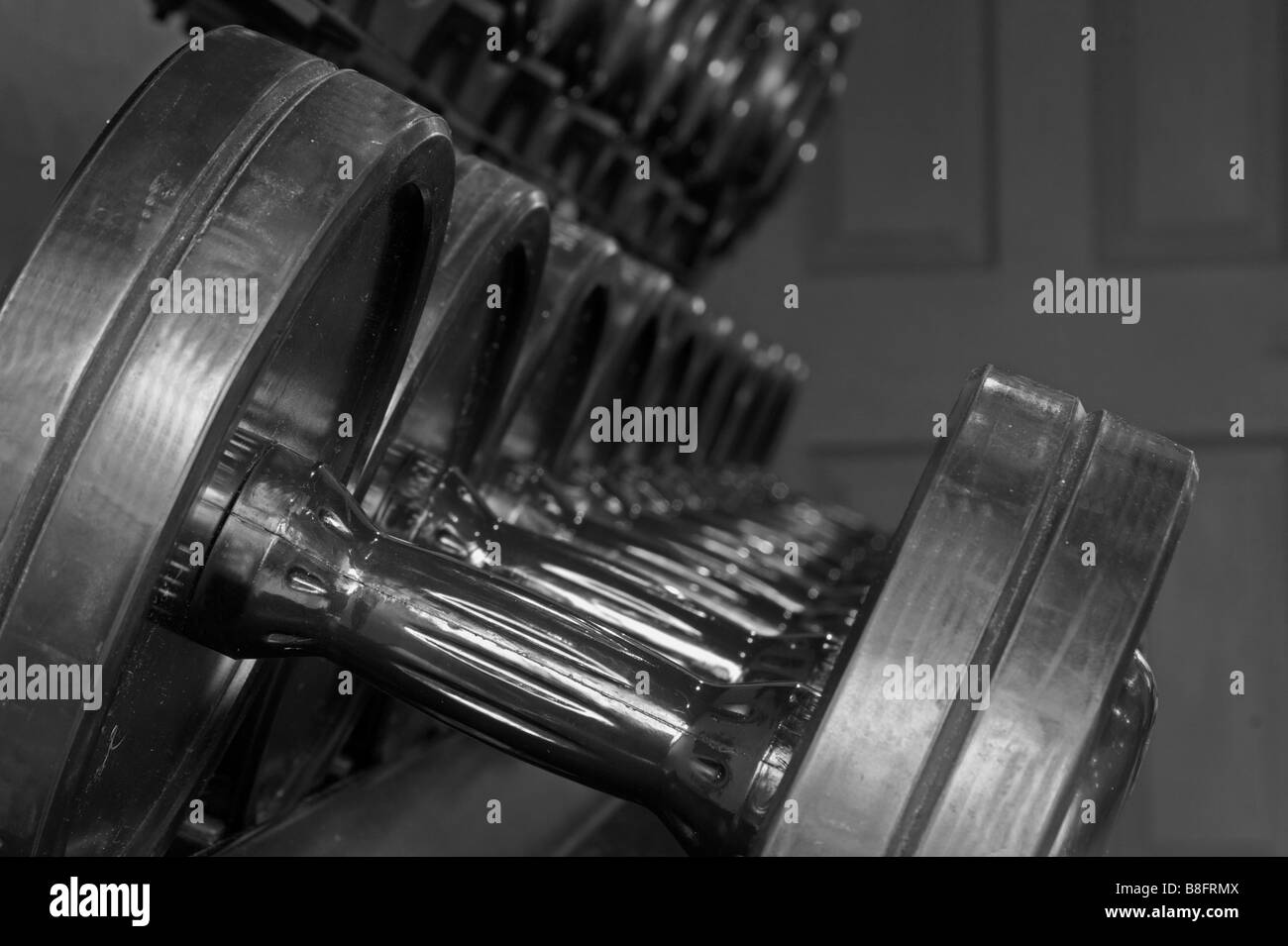 Rack of dumb bell weights Stock Photo - Alamy