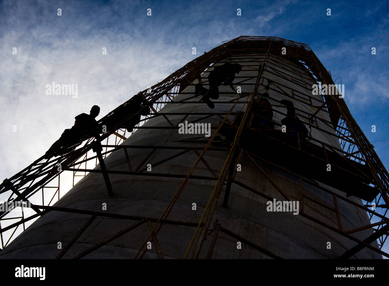 workers building a water tower Stock Photo - Alamy