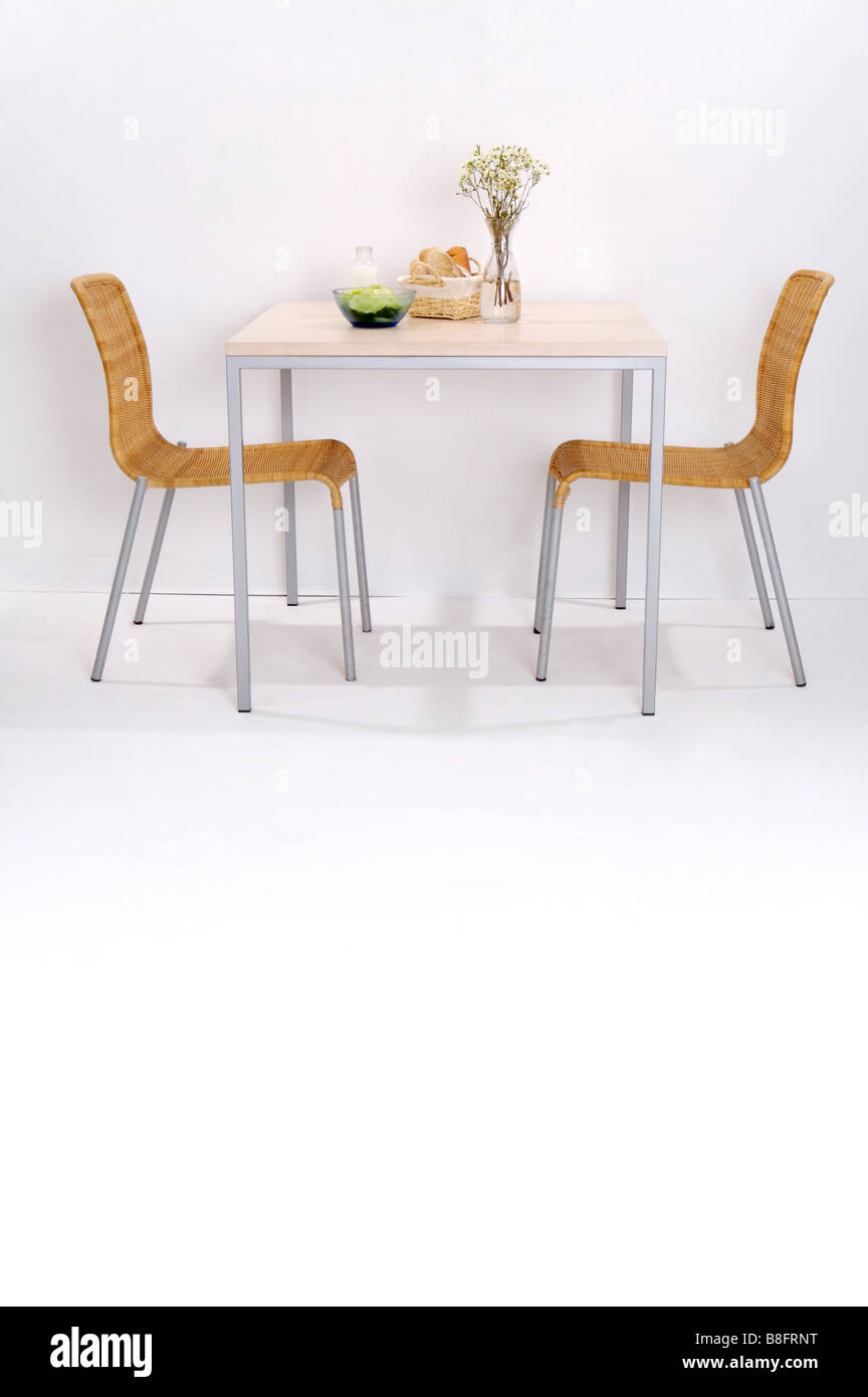Dining table with two chairs Stock Photo - Alamy