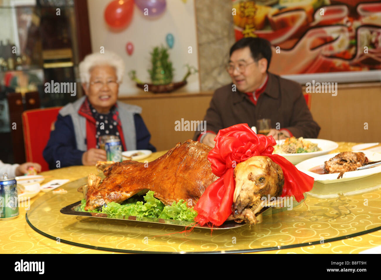 Chinese Family Having Dinner Together In The Restaurant Stock Photo - Alamy