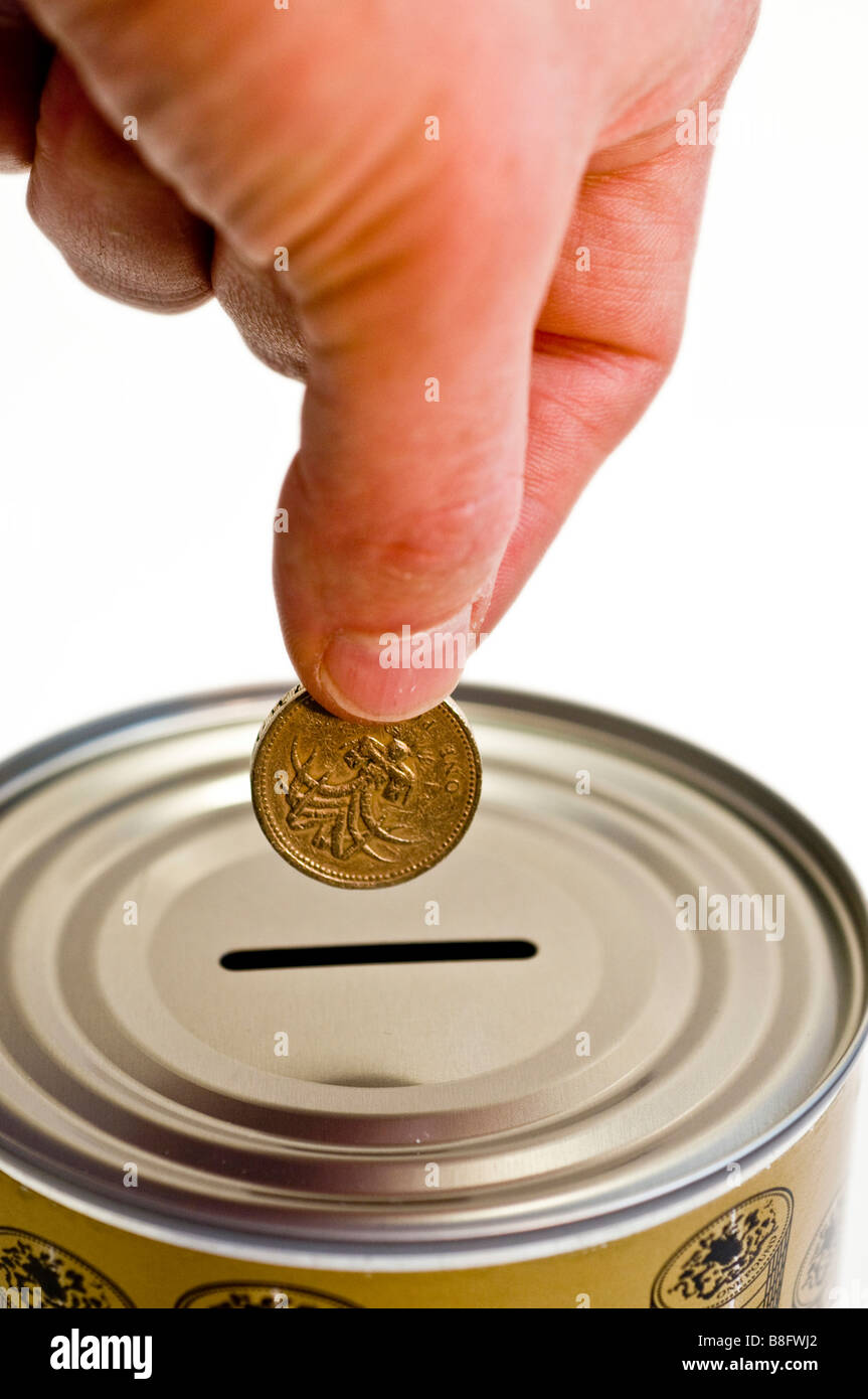 Tin can money hand hi-res stock photography and images - Alamy