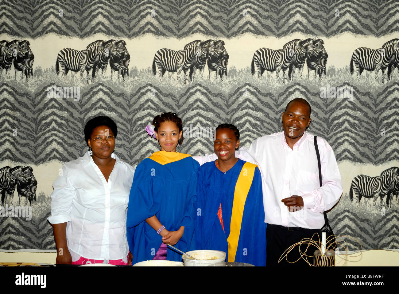 Primary school graduates with parents at graduation ceremony Stock ...