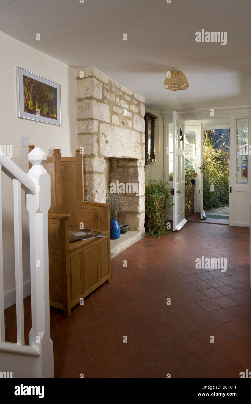 UK. A house interior, entrance hall, traditional quarry tile floor ...