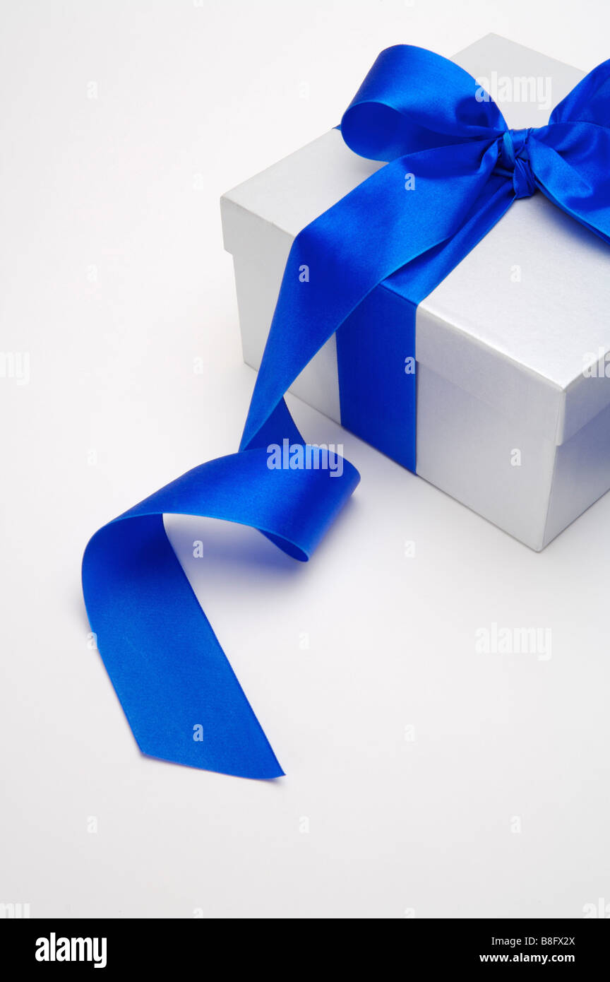 Close up of a wrapped box with blue ribbon Stock Photo - Alamy