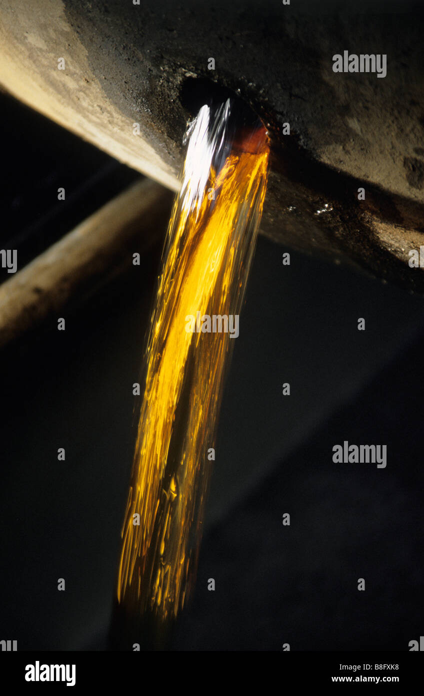 photograph of malt whisky pouring out of bung into trough Stock Photo ...