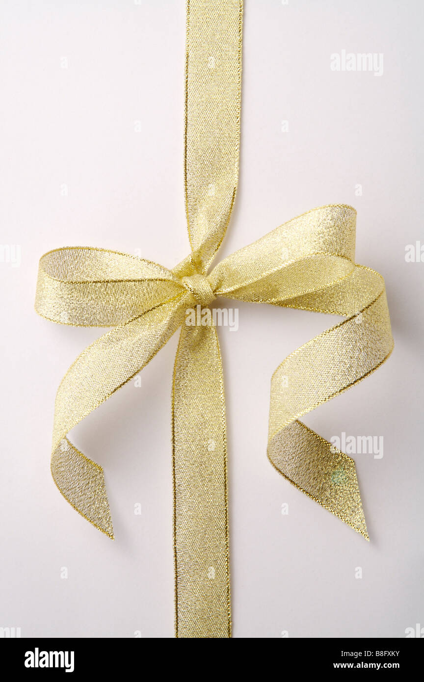 Close up of a golden tied ribbon Stock Photo - Alamy
