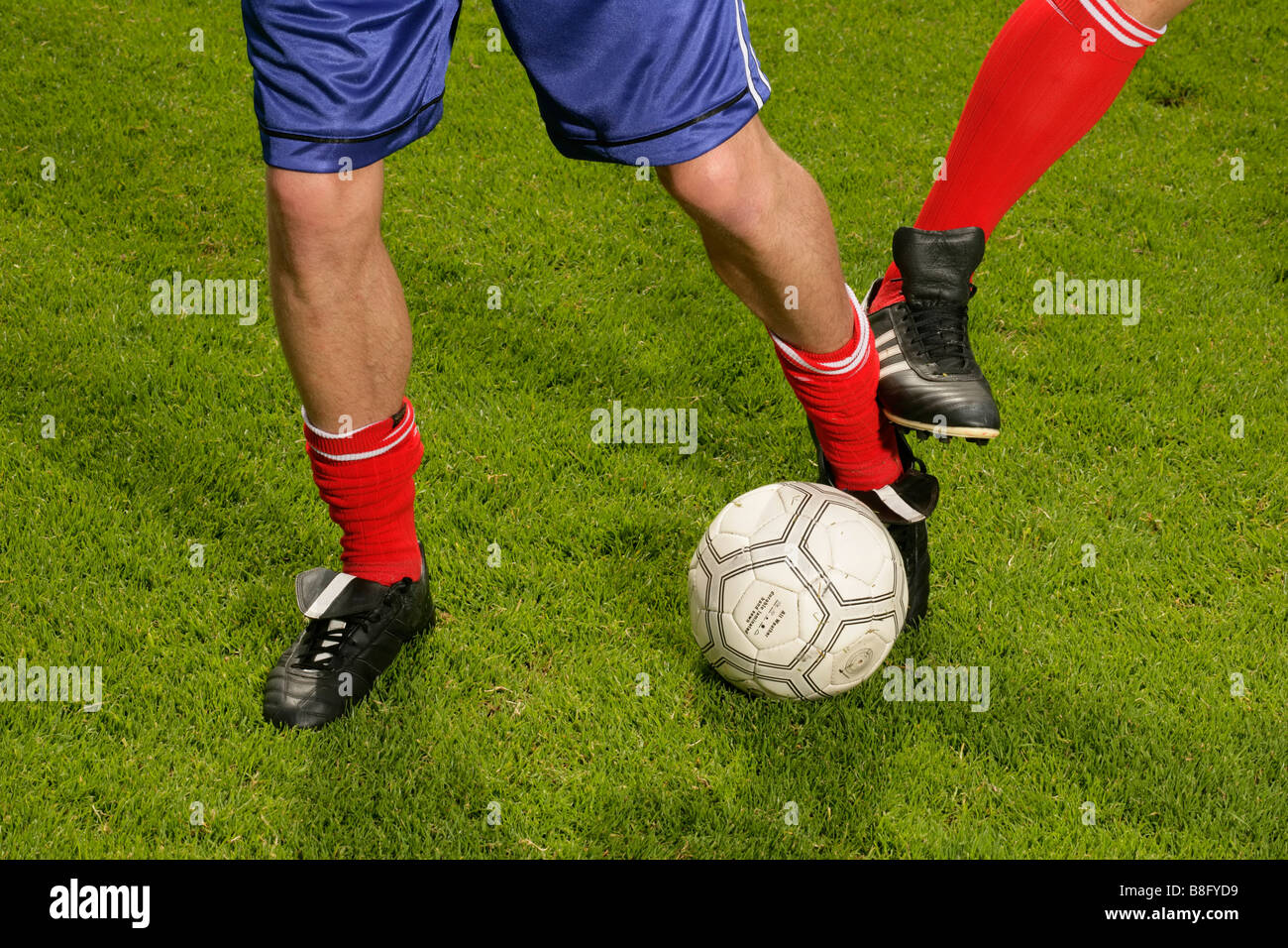 Two young men playing football (part of Stock Photo - Alamy