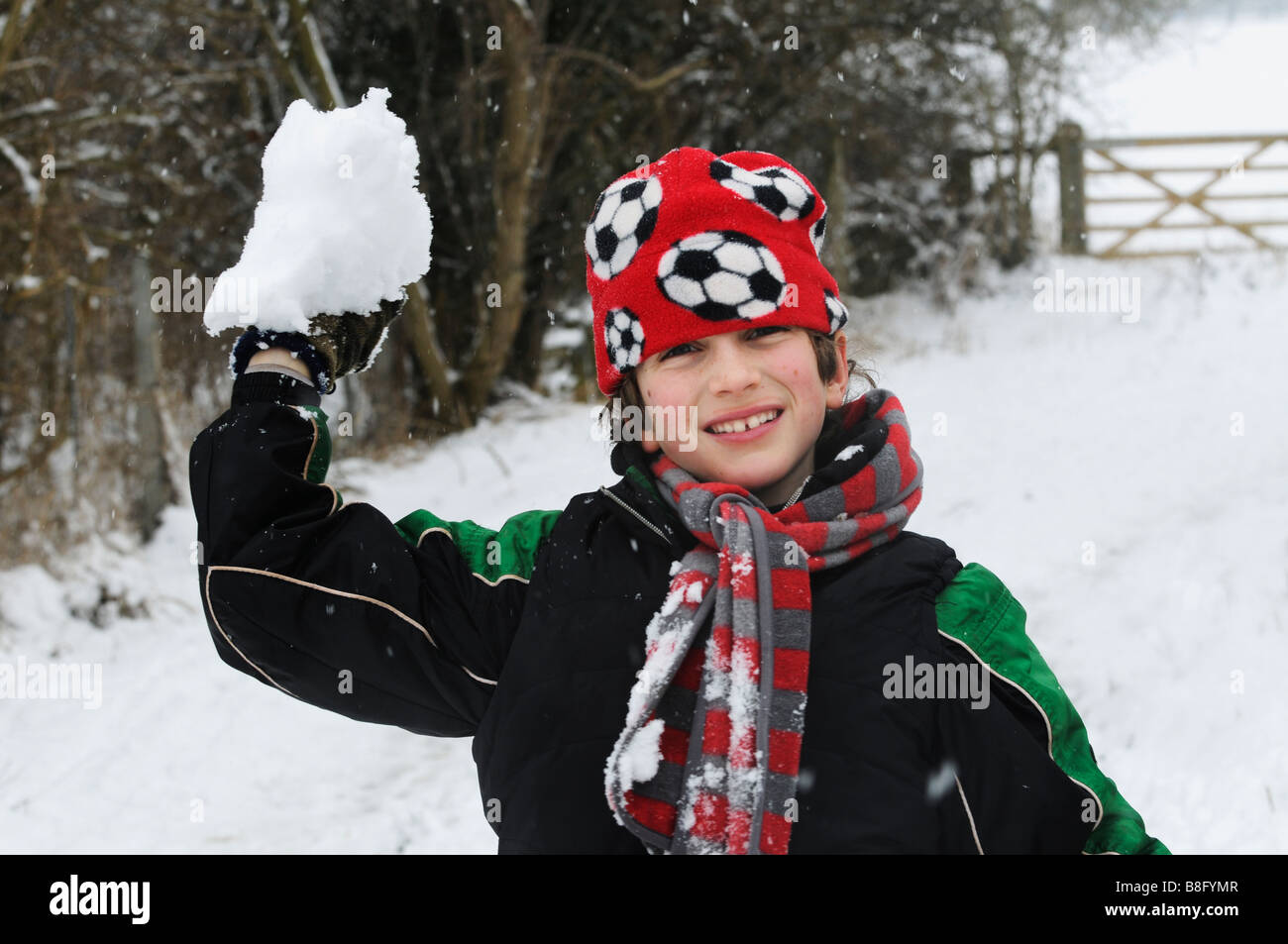 Happy kids playing snowball fight hi-res stock photography and images ...