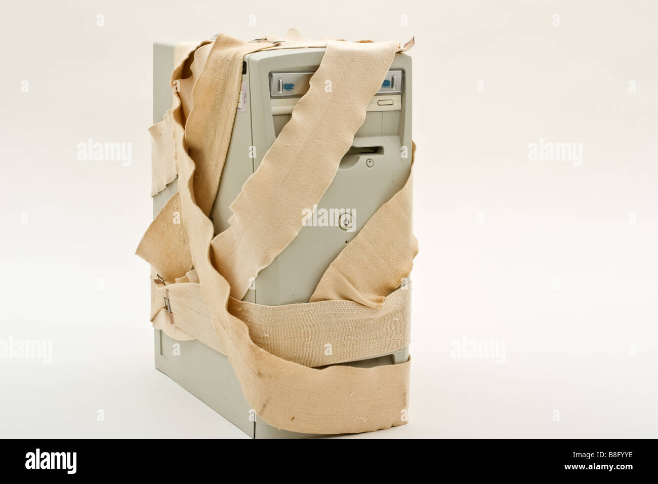 Tower style computer wrapped in an ace bandage Stock Photo - Alamy