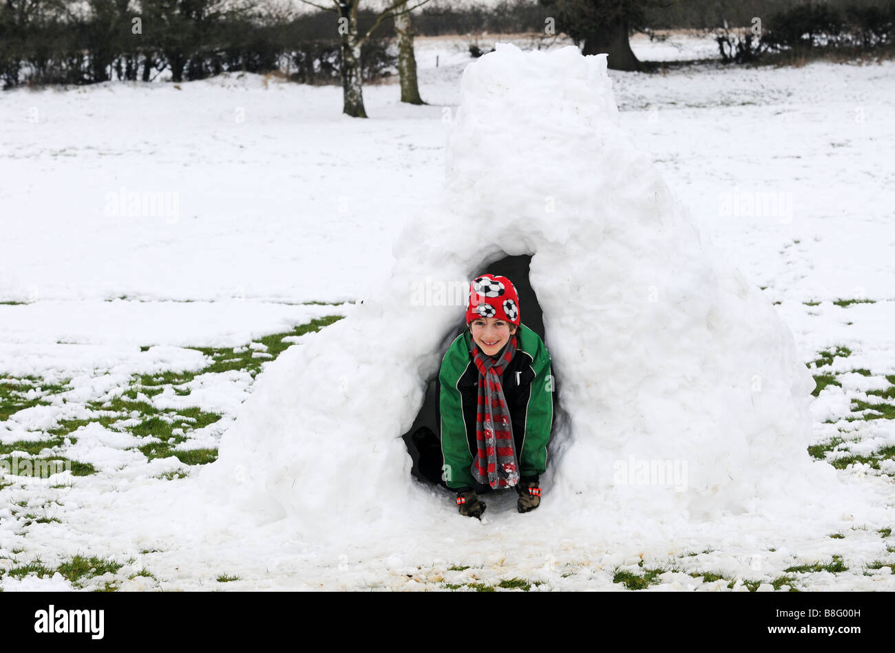 portrait of boy in snow igloo Stock Photo - Alamy