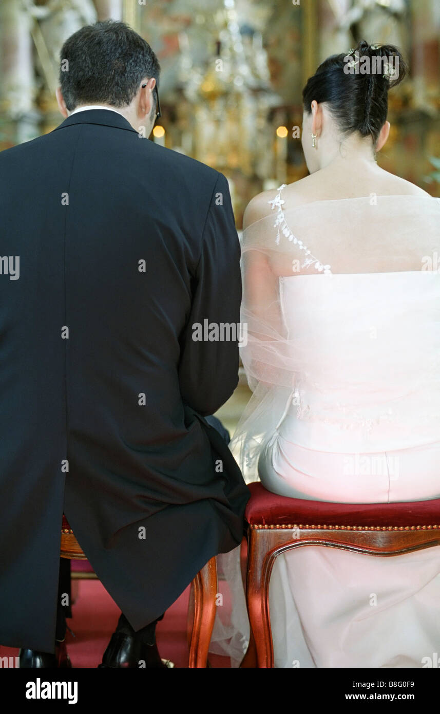 Bridegroom and Bride sitting in front of the Altar - Church - Wedding ...